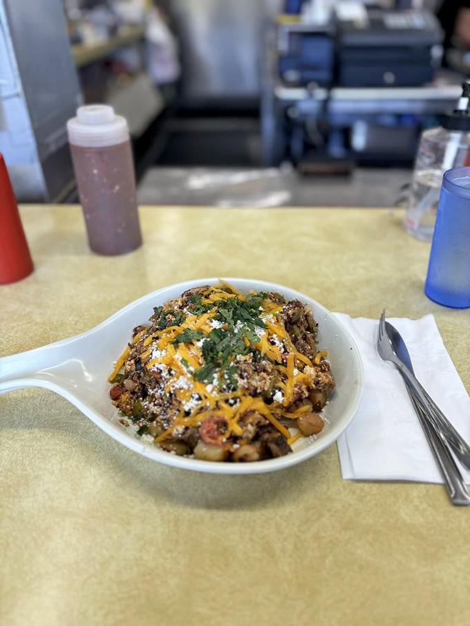 This skillet scramble isn't just breakfast&mdash;it's a treasure hunt where every forkful reveals new flavors hiding beneath the cheese.