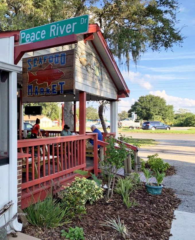 The sign says "Seafood Market" but locals know it's really "Happiness Headquarters." Follow the red railings to bliss.