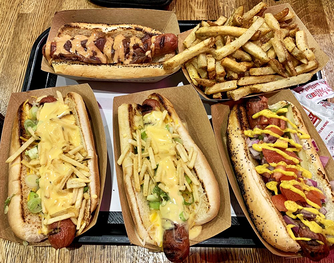 Hot dog heaven on a tray &ndash; a feast of different styles and toppings that invites exploration. Why choose one when you can try them all?