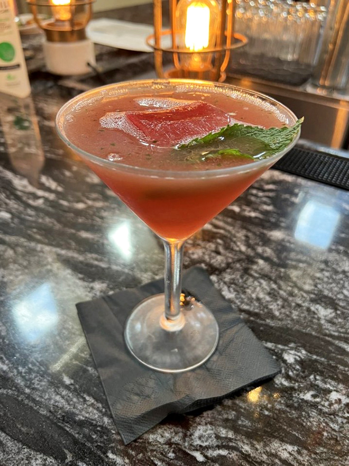 A martini that's dressed for a night out in Fort Lauderdale. That watermelon garnish isn't just decoration&mdash;it's a promise of refreshment.