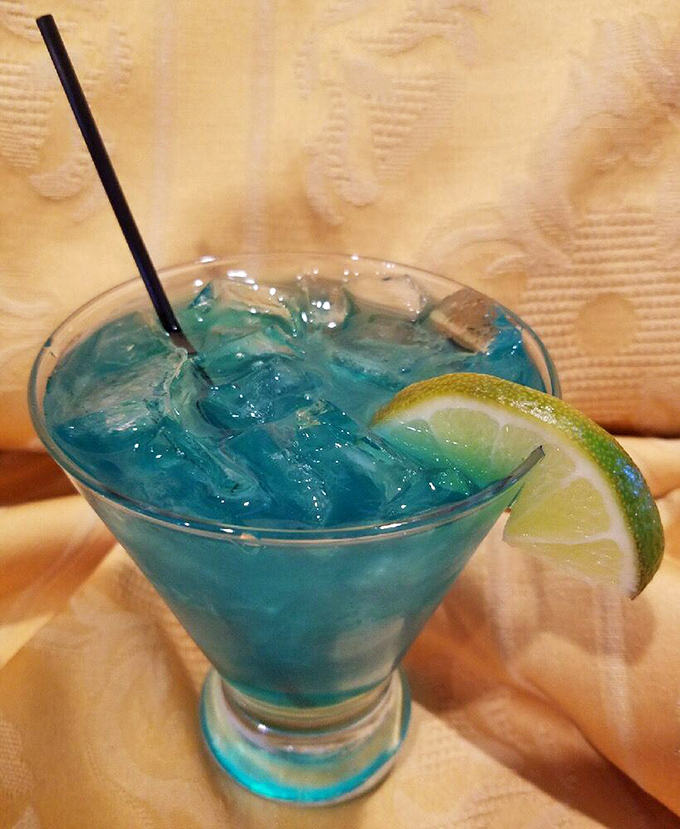 The Mermaid Water cocktail isn't just a pretty blue face&mdash;it's a refreshing counterpoint to the smoky flavors of Trout Town's famous barbecue.