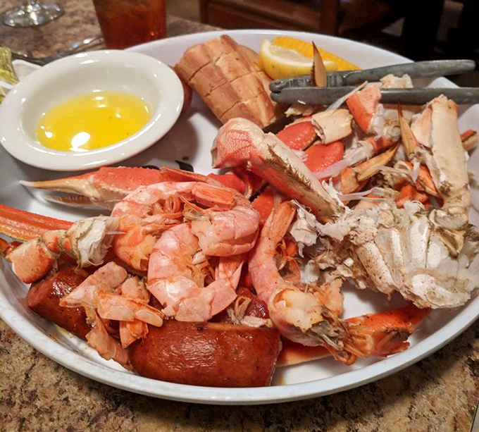 The seafood steamer platter&mdash;where crackers and tiny forks become tools of delicious destruction. Snow crab legs and shrimp waiting to surrender their treasures.