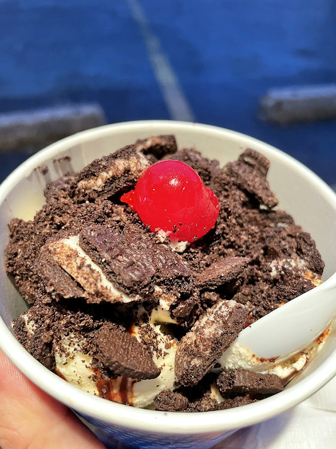 Chocolate crumbles, vanilla ice cream, and that signature cherry&mdash;a kid's sundae that makes adults seriously consider ordering from the children's menu.