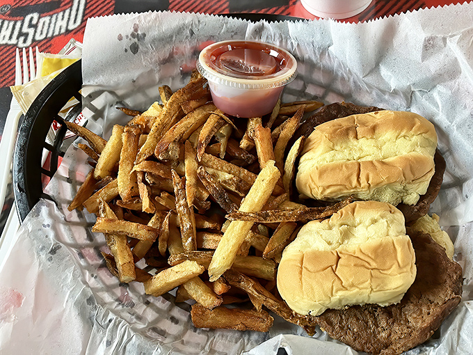 Mini burgers, maximum flavor. These sliders and fries prove that sometimes the best things come in small packages&mdash;and red plastic baskets.