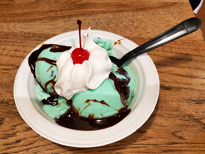 Mint ice cream drizzled with chocolate sauce and topped with whipped cream&mdash;like a refreshing breeze in a bowl.