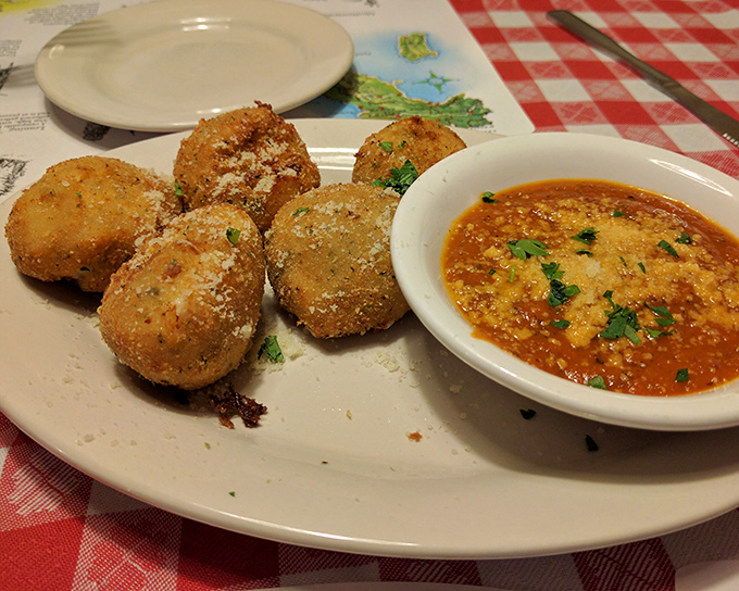 Mozzarella balls that have fulfilled their crispy-outside, melty-inside destiny. The marinara dipping sauce deserves its own fan club.