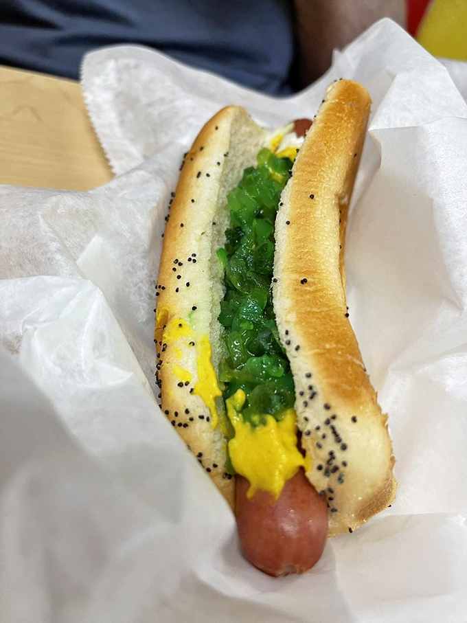 A Chicago dog in progress&mdash;the neon green relish and yellow mustard creating a color palette that screams "this ain't no ordinary hot dog."