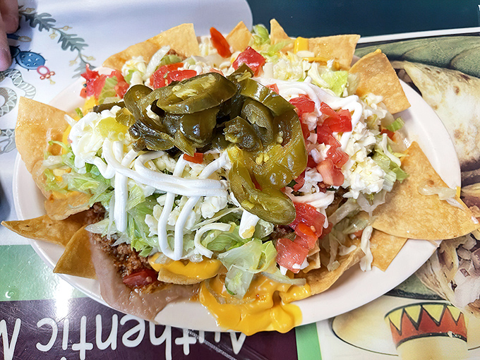 These nachos aren't the sad, soggy afterthought you find at ballparks. They're a proper meal, crowned with jalape&ntilde;os like the royalty they are.