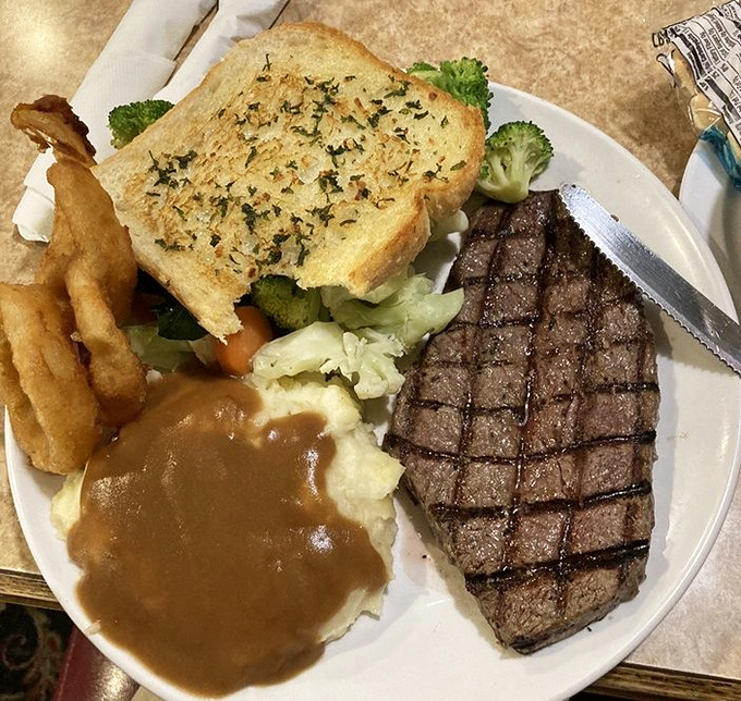 A steak that respects the basics: quality meat, perfect grill marks, and sides that know their supporting role. Simple food done right is always in style.