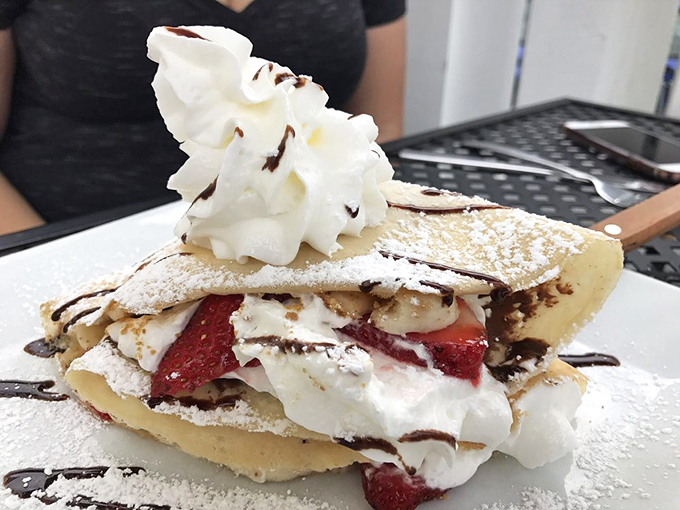 The ultimate dessert trifecta: Nutella, strawberries, and whipped cream nestled in a delicate crepe. Worth every moment on the treadmill tomorrow.