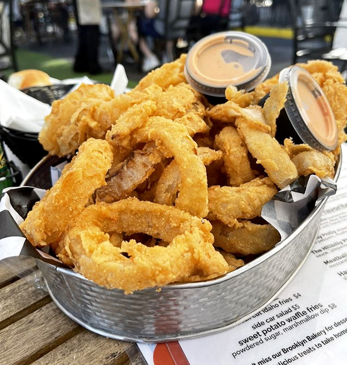 Onion rings that achieve that perfect crunch-to-tenderness ratio. These golden hoops of happiness make a compelling case for ordering appetizers as your main course.