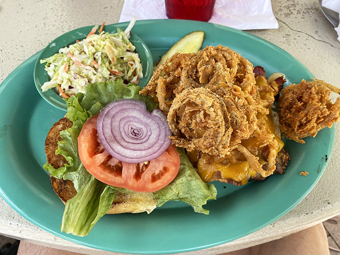 This isn't just a burger&mdash;it's architecture. Crispy onion rings crown a perfectly grilled patty, creating a tower of flavor that demands a strategy to eat.