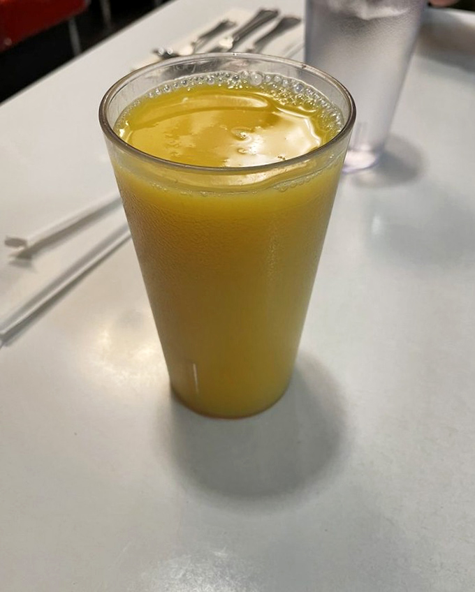 Orange juice so fresh and vibrant it practically glows, demanding respect as the unsung hero of breakfast beverages everywhere.