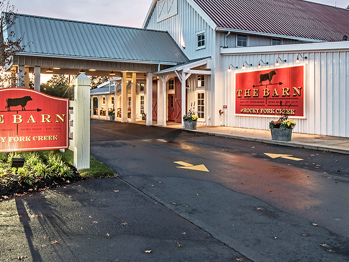 As dusk settles, The Barn transforms from restaurant to landmark. That illuminated sign isn't just advertising—it's a beacon for hungry souls.