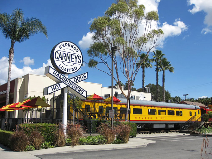 From this angle, the yellow train car looks like it just pulled into Flavor Station, ready to serve up another day of burger bliss to hungry passengers.