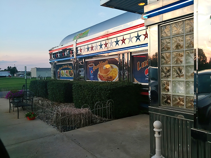Even the exterior says "stay awhile"&mdash;benches and planters creating a moment of pause before the feast begins inside.