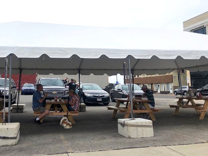 The outdoor dining area under the awning offers a perfect spot to enjoy your meal while soaking in small-town charm.