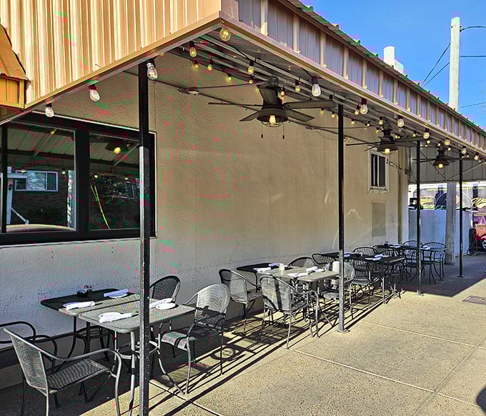 Sidewalk seating for those who like their people-watching with a side of pasta. The string lights promise al fresco magic as evening falls.