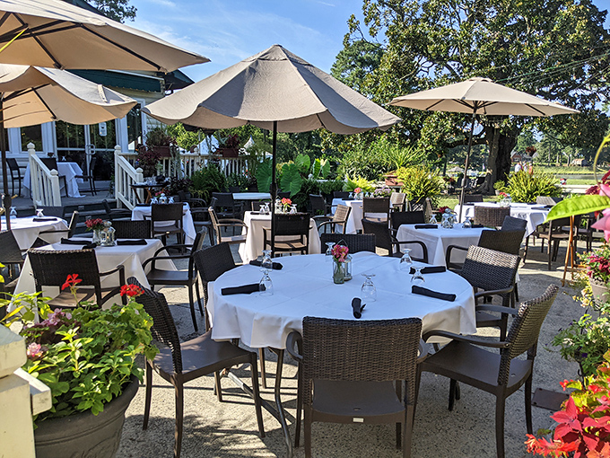 Umbrella-shaded tables surrounded by flowers create the perfect setting for that "I can't believe we live close enough to come here" moment.