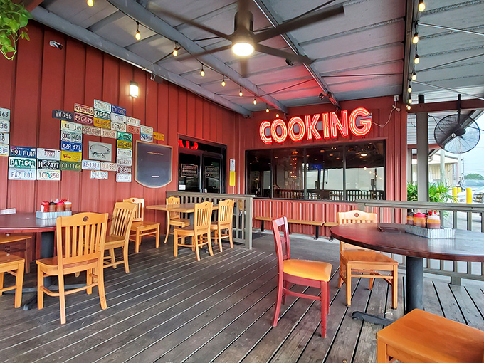 The outdoor seating area, with its red "COOKING" sign, offers a front-row seat to barbecue paradise&mdash;where license plates from visitors mark pilgrimages from afar.