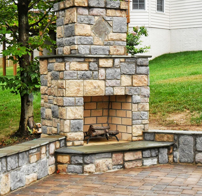 While not part of the restaurant, this outdoor stone fireplace captures the same timeless charm that makes Fredericksburg a perfect setting for Olde Towne's classic dining experience.