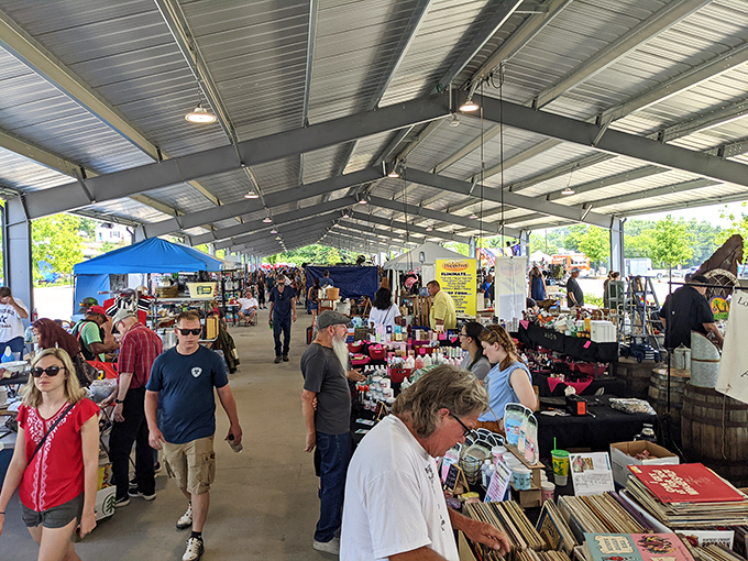 Sunlight streams through the covered outdoor market, illuminating a world of possibilities. Weekend warriors and professional pickers alike navigate this sea of potential discoveries.