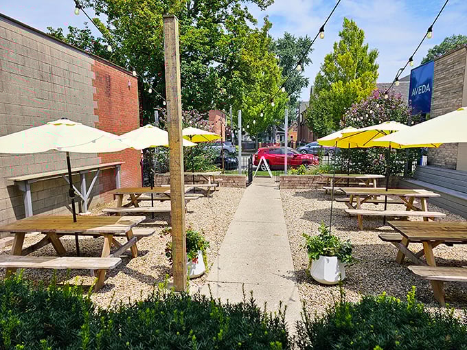 The outdoor dining area&mdash;where string lights, yellow umbrellas, and picnic tables create the perfect stage for your personal meat festival.