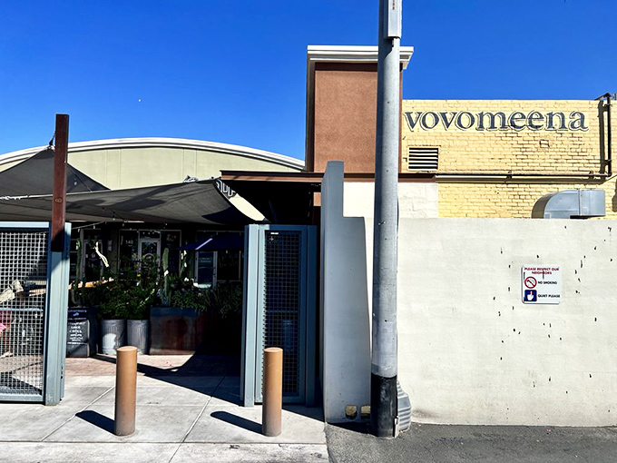 Even from the outside, that yellow wall acts like a breakfast lighthouse, guiding hungry souls to their morning salvation.