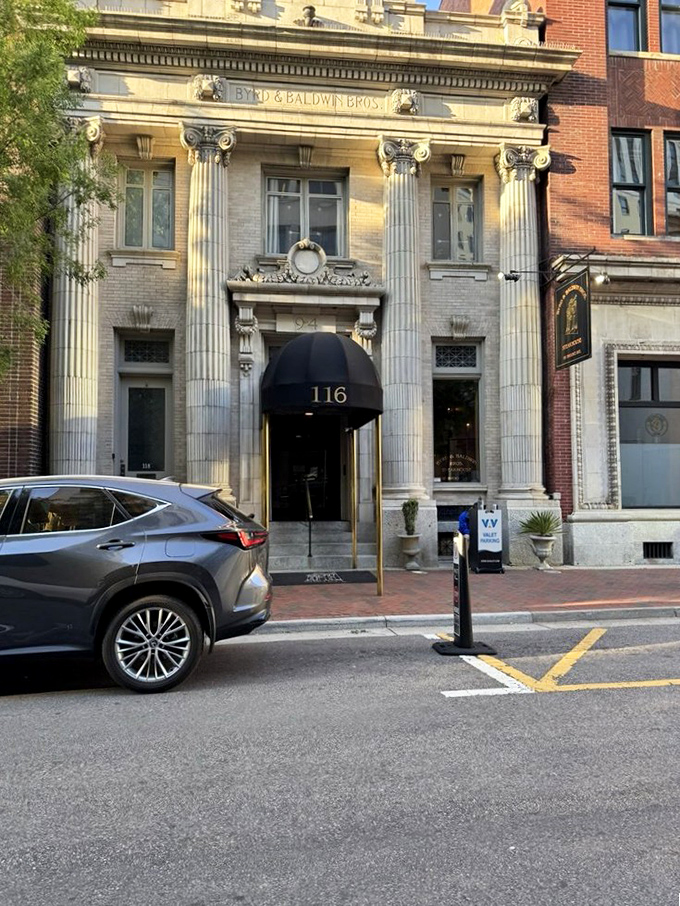 The name "Byrd & Baldwin Bros." etched above those impressive columns—a landmark that signals your exceptional dining experience is about to begin.