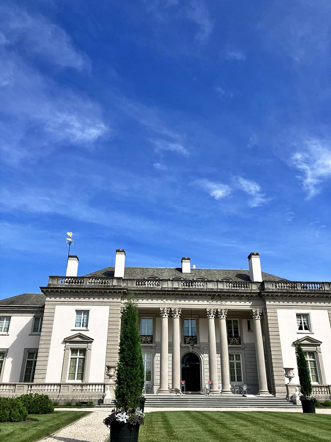 Blue skies frame the mansion like it was custom-ordered from a catalog of perfect architectural backdrops. 
