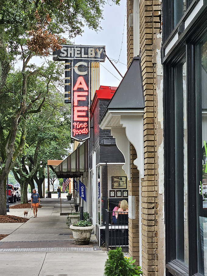 That vintage neon sign has guided hungry travelers for decades. Like a lighthouse for those lost in a sea of chain restaurants and culinary mediocrity.
