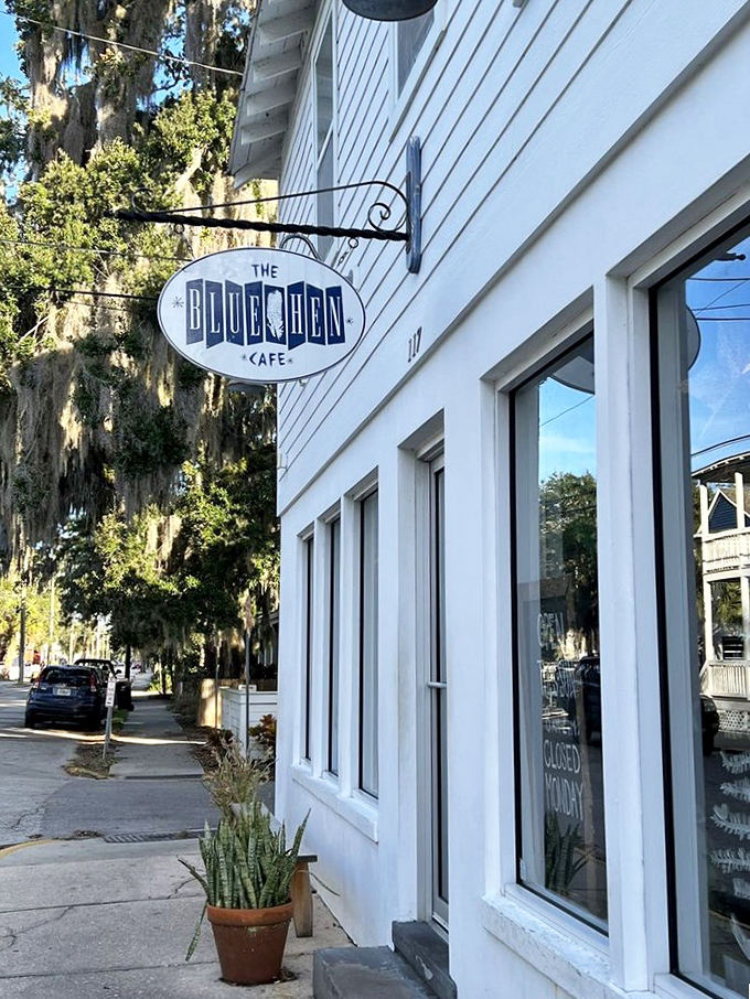 That Blue Hen sign hanging outside isn't just a name—it's a promise of breakfast excellence waiting behind that pristine white facade.