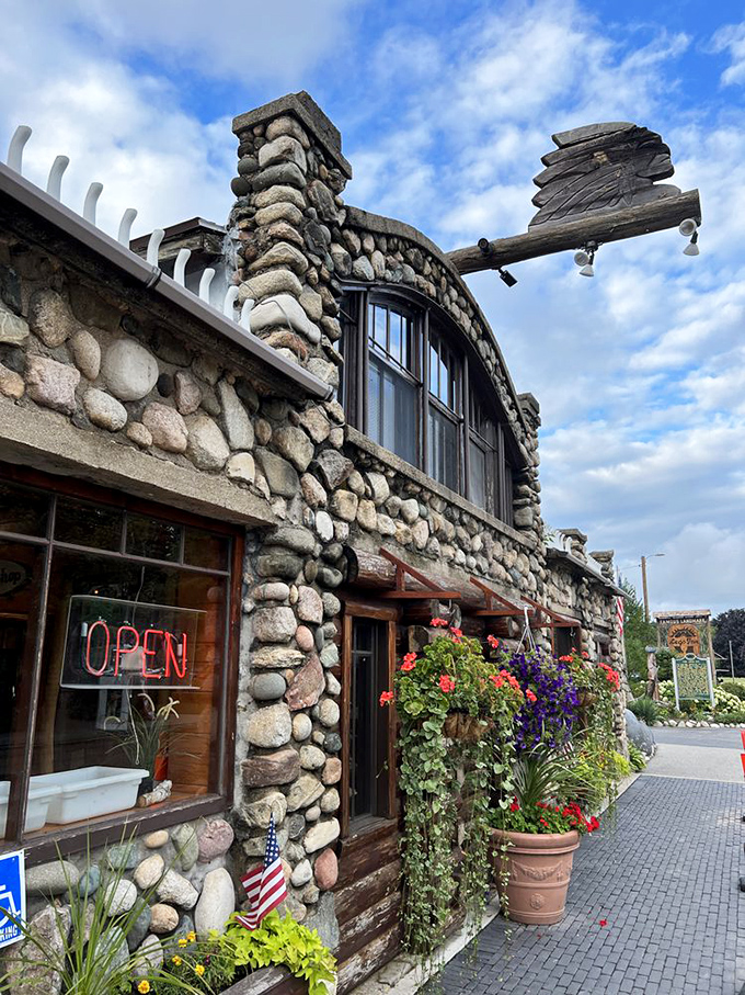 Fieldstone walls adorned with vibrant flower baskets welcome visitors to this northern Michigan treasure, where Polish cuisine meets Up North charm in the most delightful cultural collision.
