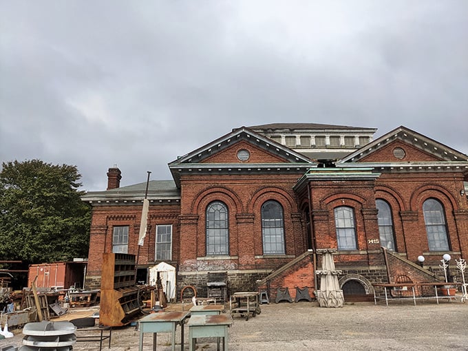 The imposing brick facade houses architectural wonders while outdoor treasures wait patiently for someone who appreciates history's craftsmanship.