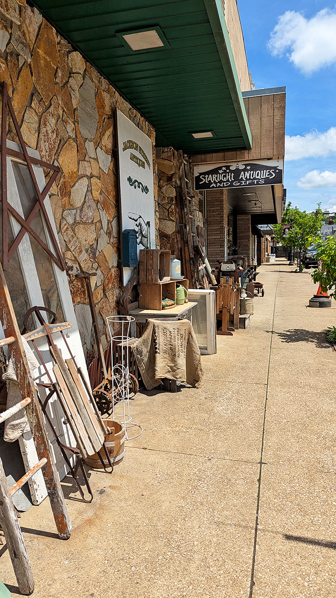 The hunt begins before you even enter. This sidewalk display of architectural salvage and rustic treasures sets the tone for what awaits inside.