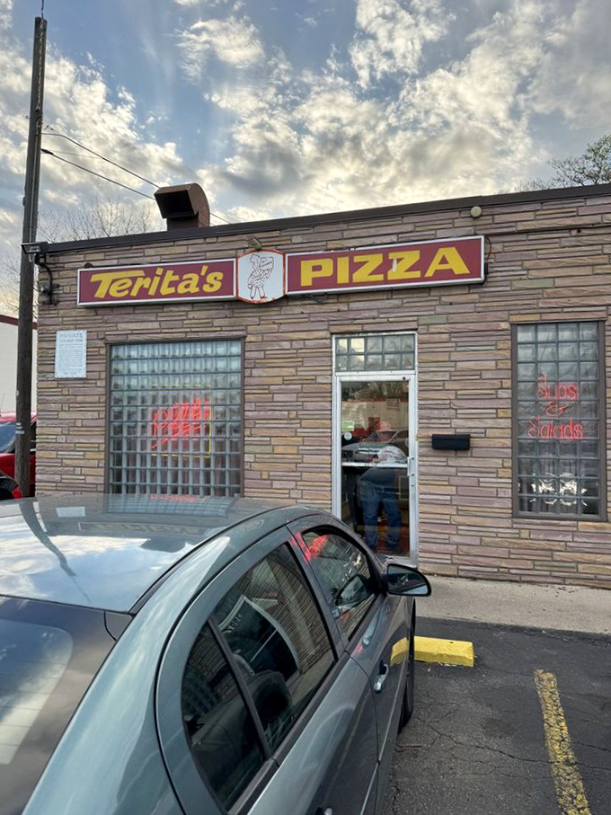 The exterior view that locals know by heart—where countless Ohioans have parked, entered hungry, and left with boxes of pure happiness.