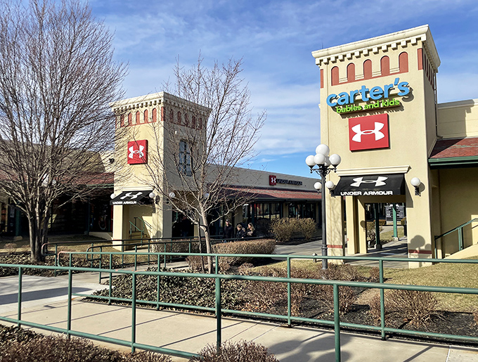 Architectural charm meets retail therapy. Under Armour and Carter's stand ready for your arrival, their distinctive facades promising brand names without the brand prices.