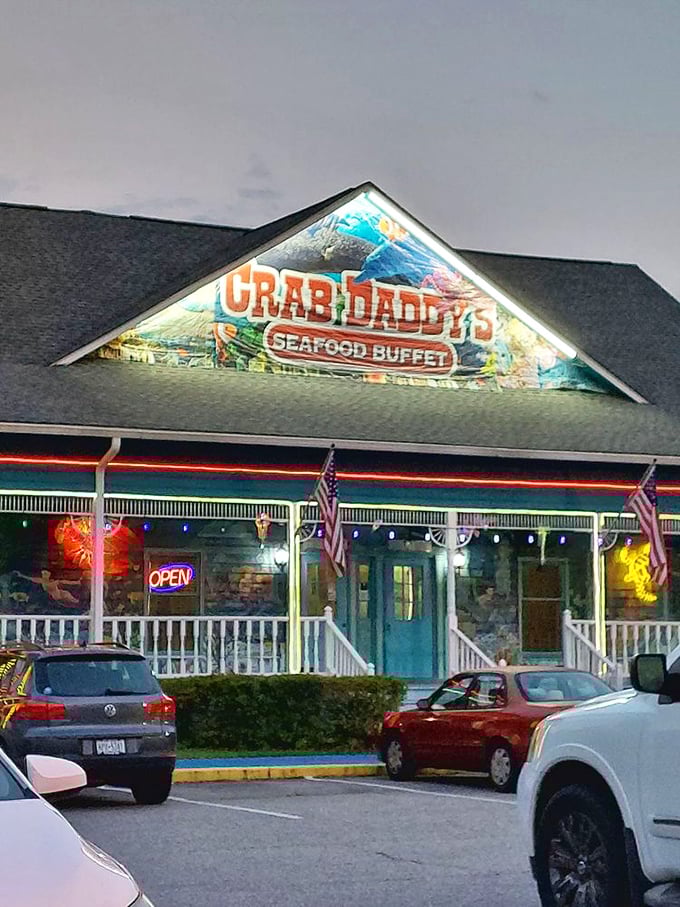 As dusk falls, Crab Daddy's glows like a lighthouse for the hungry. Cars in the lot tell the story: people come from everywhere for this feast.