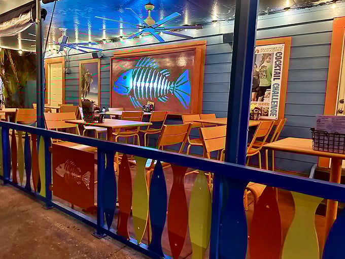 The outdoor dining area's vibrant colors and fish motifs remind you that yes, you're exactly where you should be.
