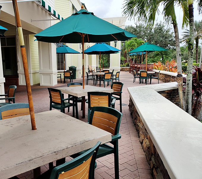 Al fresco dining under turquoise umbrellas. The perfect setting for enjoying seafood while soaking up that famous Florida sunshine.