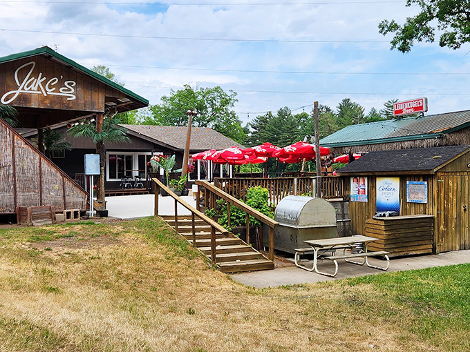 The outdoor setting reveals Jake's full footprint – a beloved destination where summer memories are made between umbrella-shaded tables.