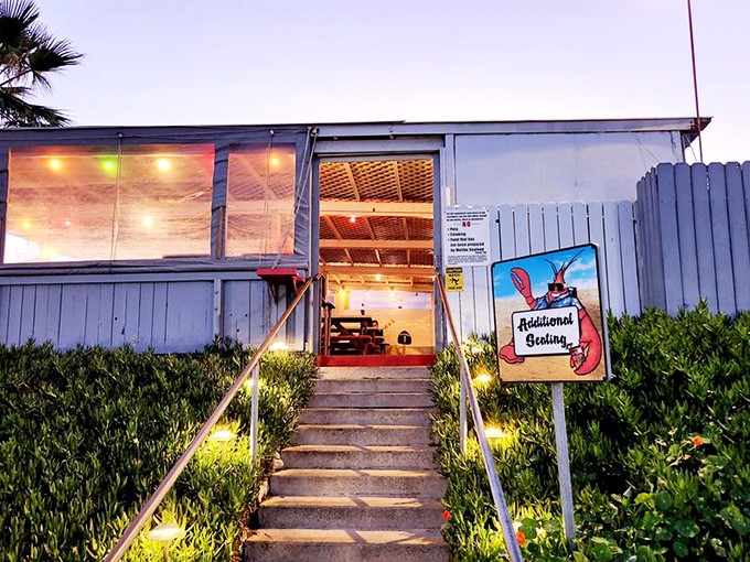 As evening falls, the patio lights twinkle like stars, creating the perfect California moment for enjoying the day's catch.