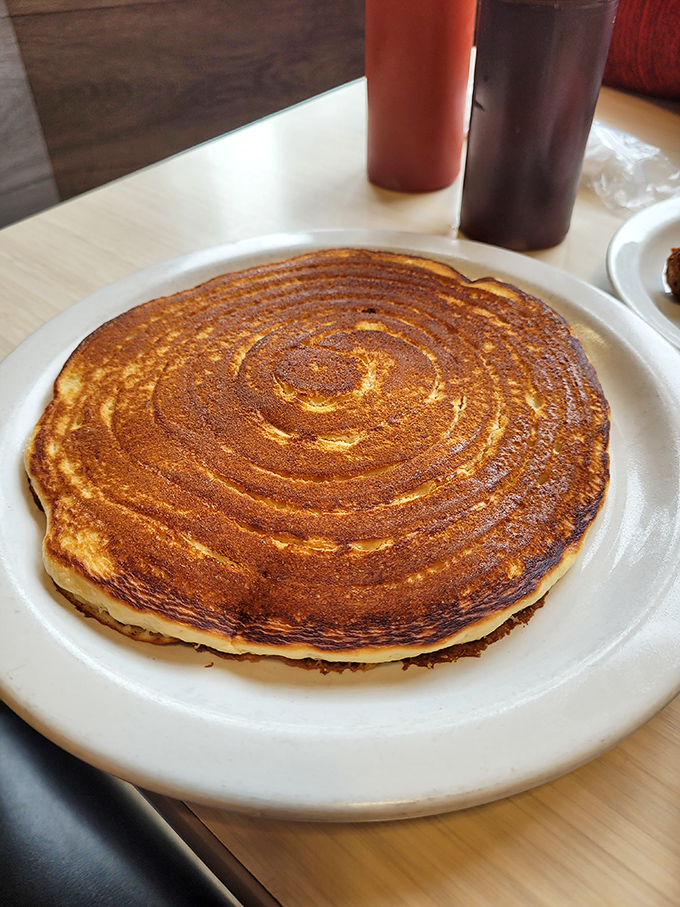 This pancake isn't just perfectly browned&mdash;it's a golden canvas of possibility that makes you wonder if breakfast might actually be the most important art form.