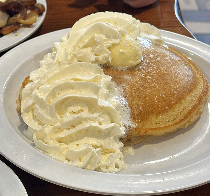 A pancake crowned with whipped cream and butter&mdash;the breakfast equivalent of pulling up to a red carpet in a limousine.