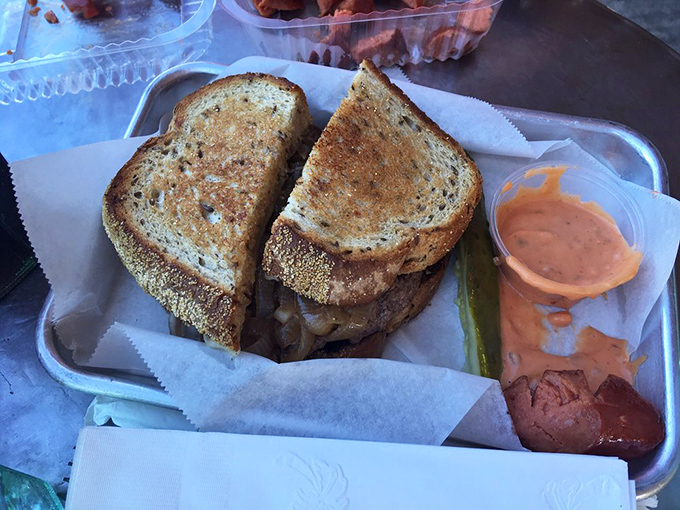 The humble patty melt, elevated to art form. Between those perfectly grilled slices lies a world of melty, beefy perfection.