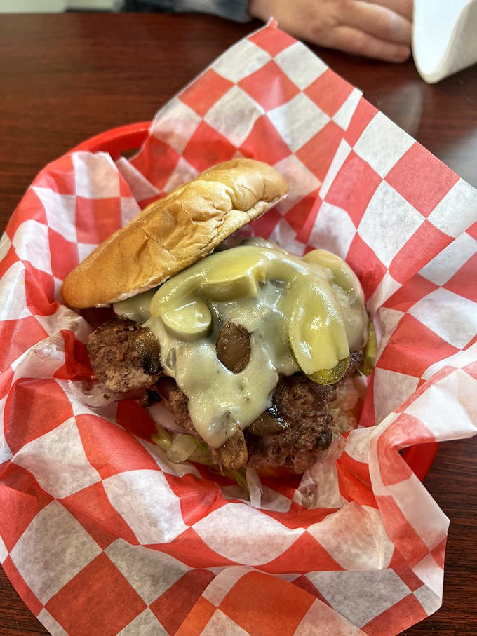 The Paul Brown Burger pays homage to Cleveland football royalty. Melted cheese cascades over a perfectly seared patty like the tears of opposing teams facing the Browns in their prime.