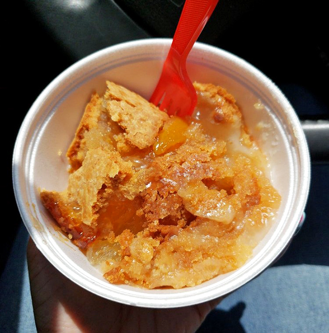 Peach cobbler that honors Georgia's favorite fruit while providing sweet relief after the spice storm. That crumbly topping is what dreams are made of.