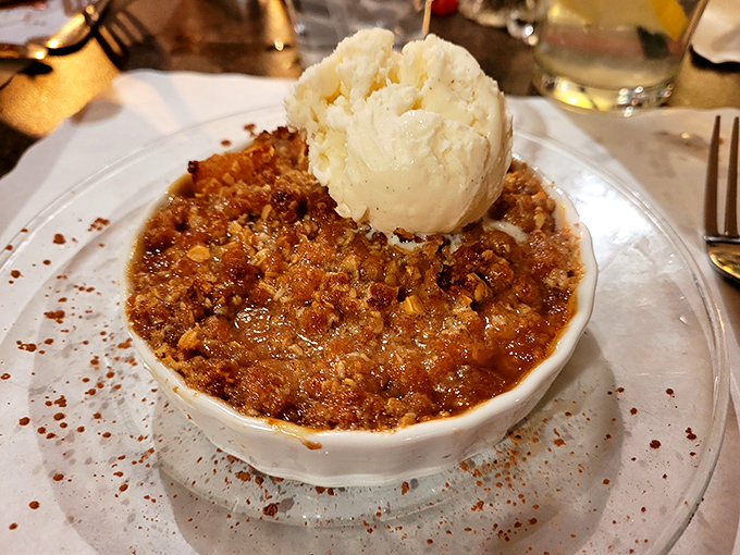 Not just pecan pie but a warm, gooey commitment to happiness, crowned with ice cream melting into all the right crevices.