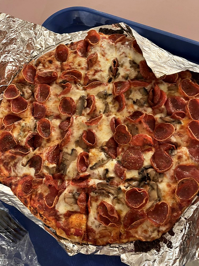 The pepperoni and mushroom pizza&mdash;a study in contrasts where crispy meets chewy, savory meets earthy, and hunger meets its match.