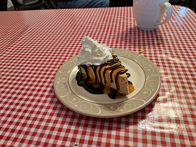 A slice of heaven drizzled with chocolate and caramel, topped with whipped cream&mdash;proof that dessert is not just a course, but a necessity.